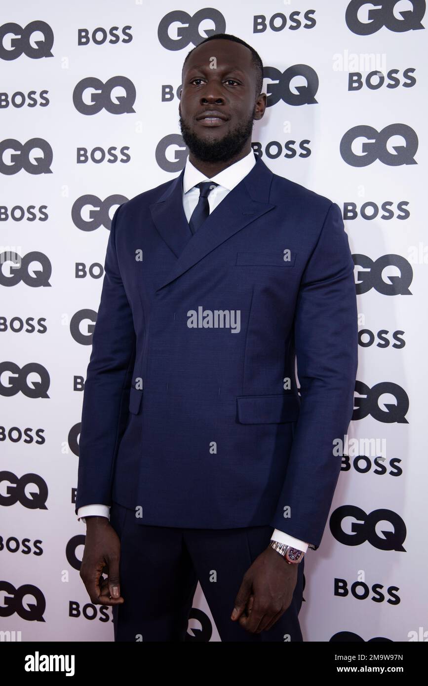 Stormzy poses for photographers upon arrival at the GQ Men of the Year ...