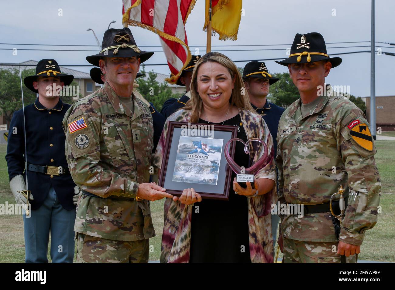 Mrs. Nicole Halladay, 3rd Armored Brigade Combat Team, receives the 'Heart' trophy during the ...