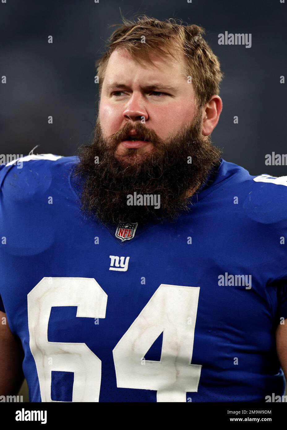 New York Giants guard Mark Glowinski (64) walks off the field after an ...