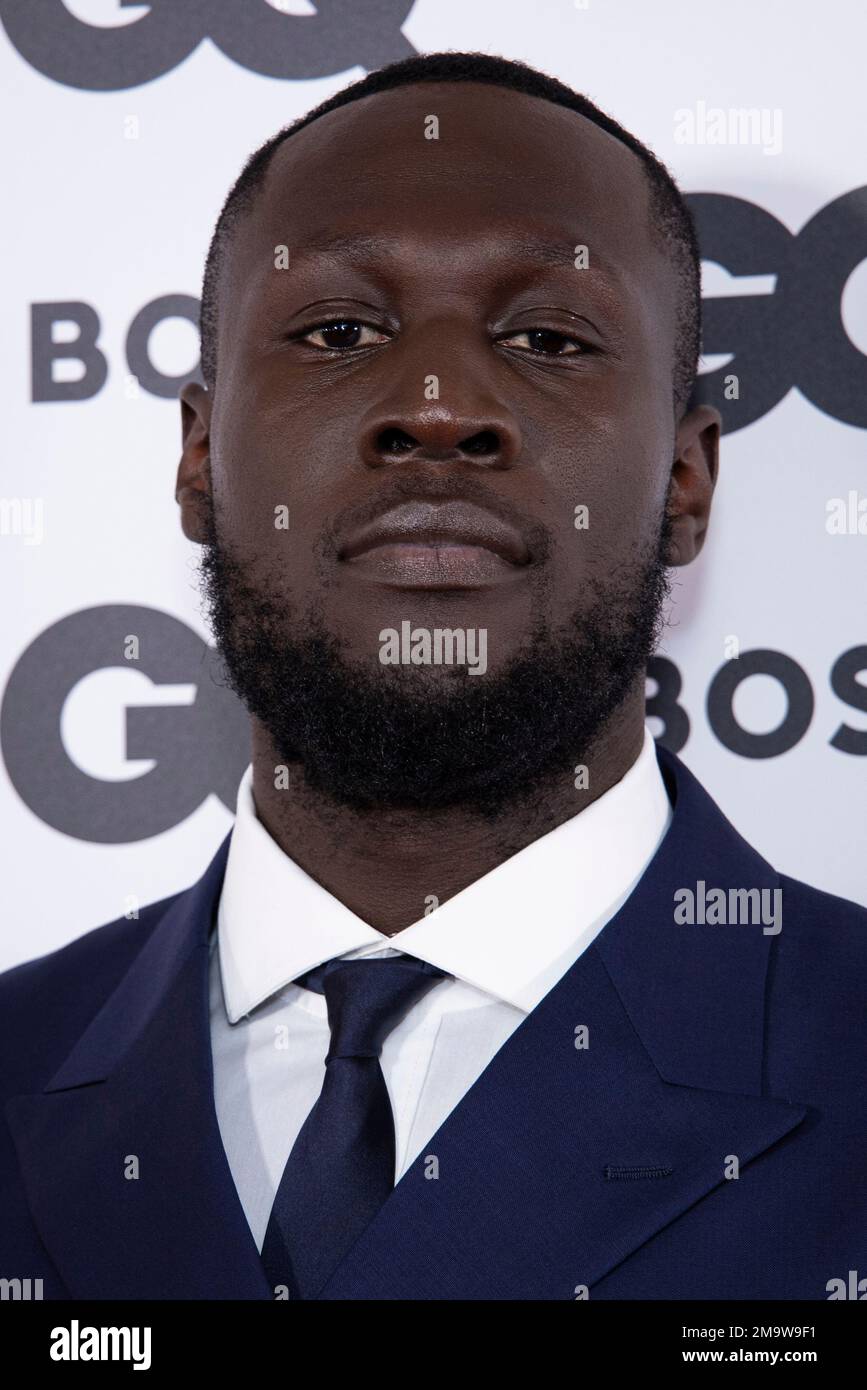 Stormzy poses for photographers upon arrival at the GQ Men of the Year ...
