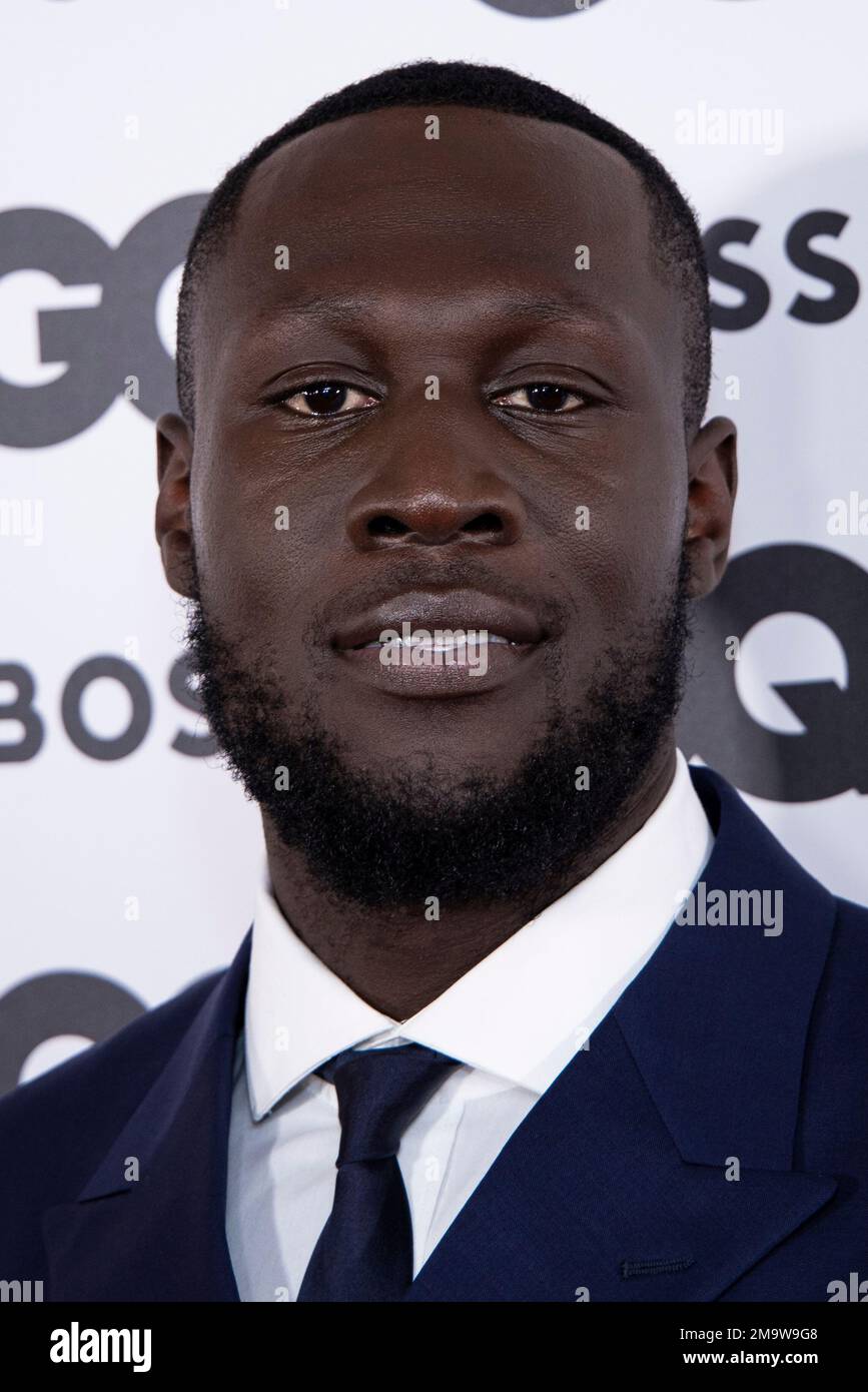 Stormzy poses for photographers upon arrival at the GQ Men of the Year ...