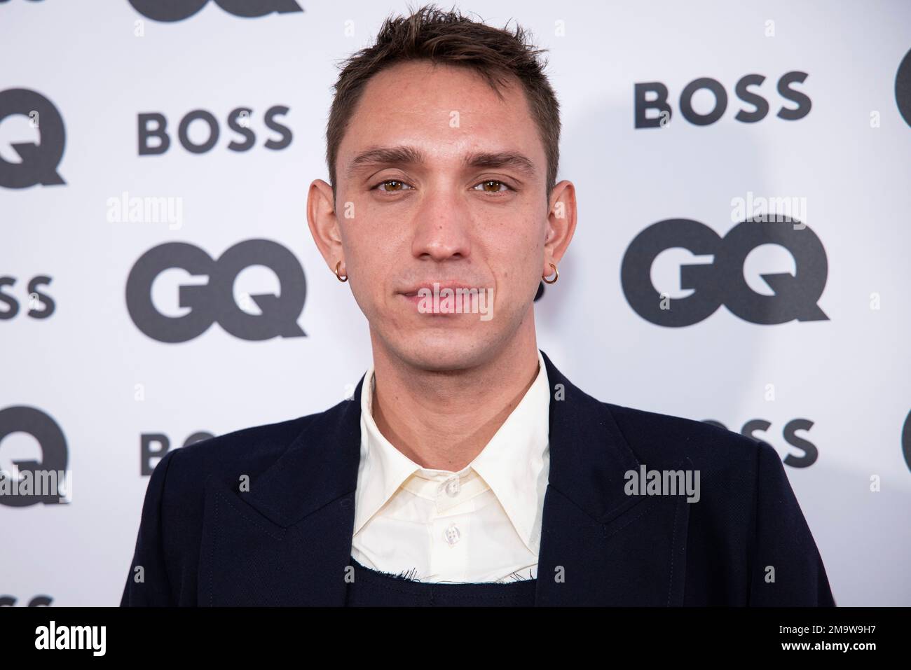 Oliver Sim poses for photographers upon arrival at the GQ Men of the ...