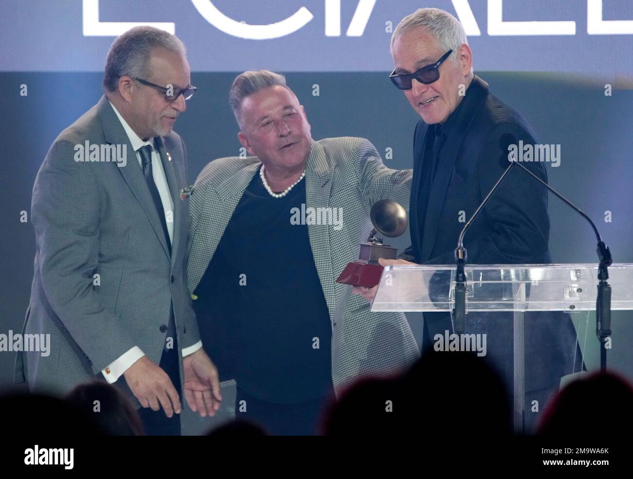Yordano, right, receives a lifetime achievement award from Ricardo Montaner, center, and Manuel ...
