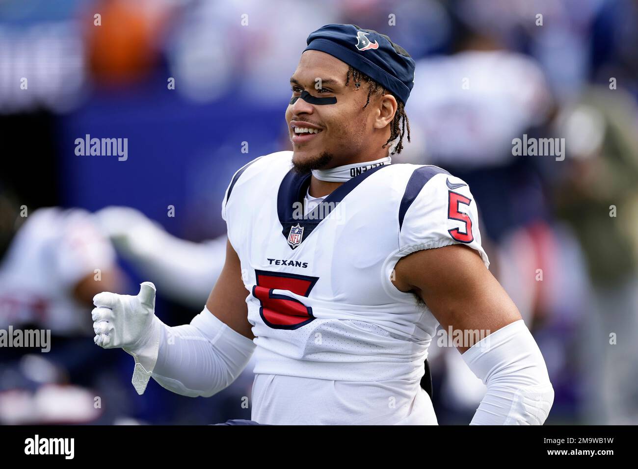 Houston Texans safety Jalen Pitre (5) warms up before taking on the New ...