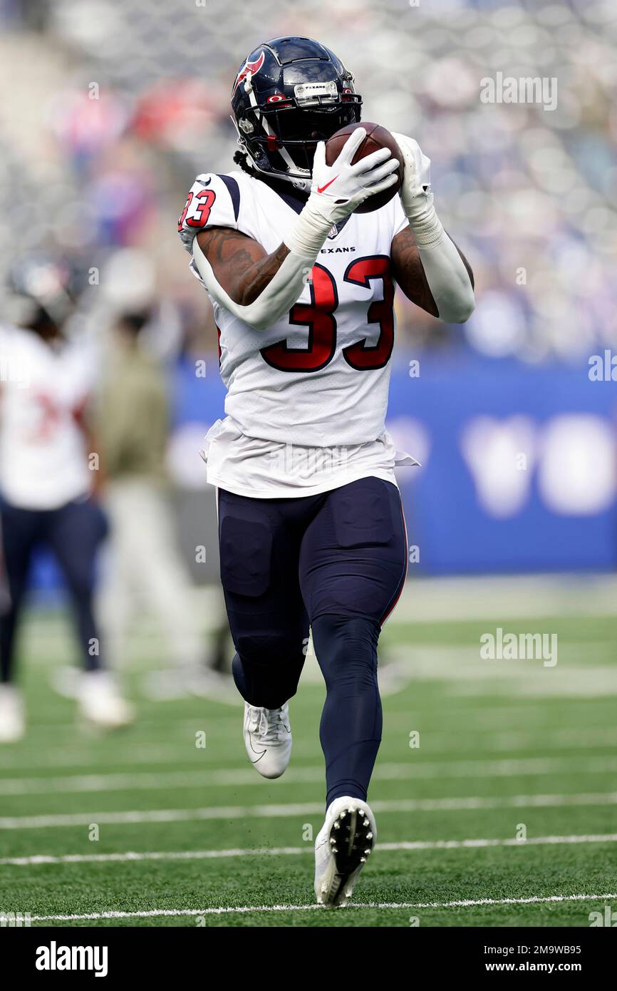 Houston Texans running back Dare Ogunbowale (33) warms up before taking ...