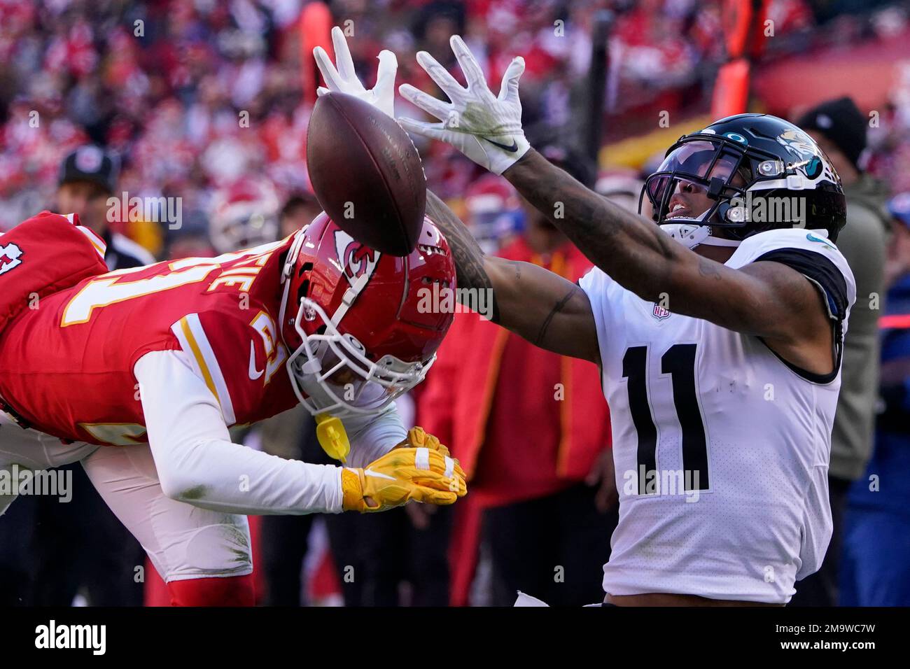 Kansas City Chiefs cornerback Trent McDuffie (21) breaks up a pass ...