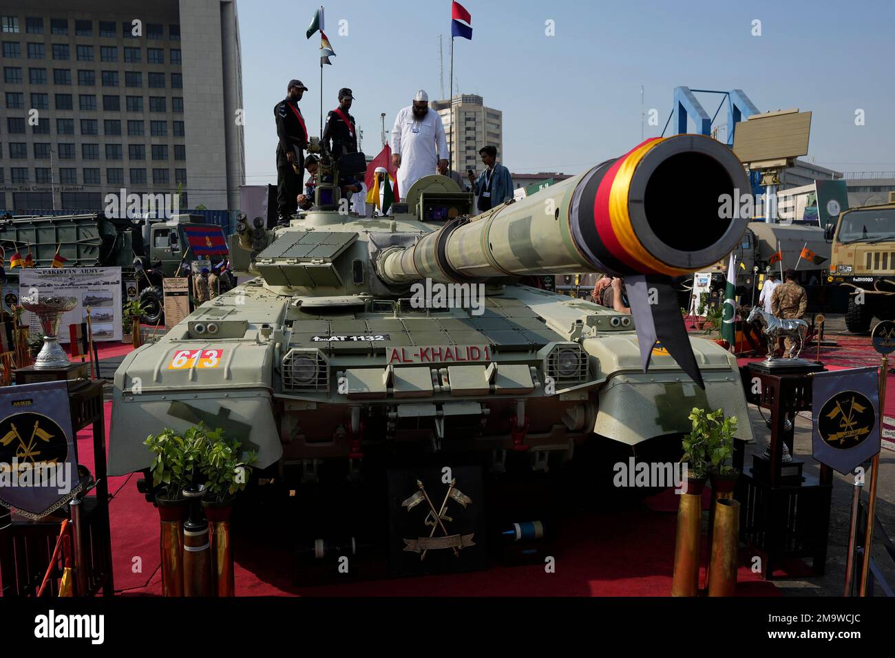 People view a Pakistani indigenous tank displayed during a defense ...