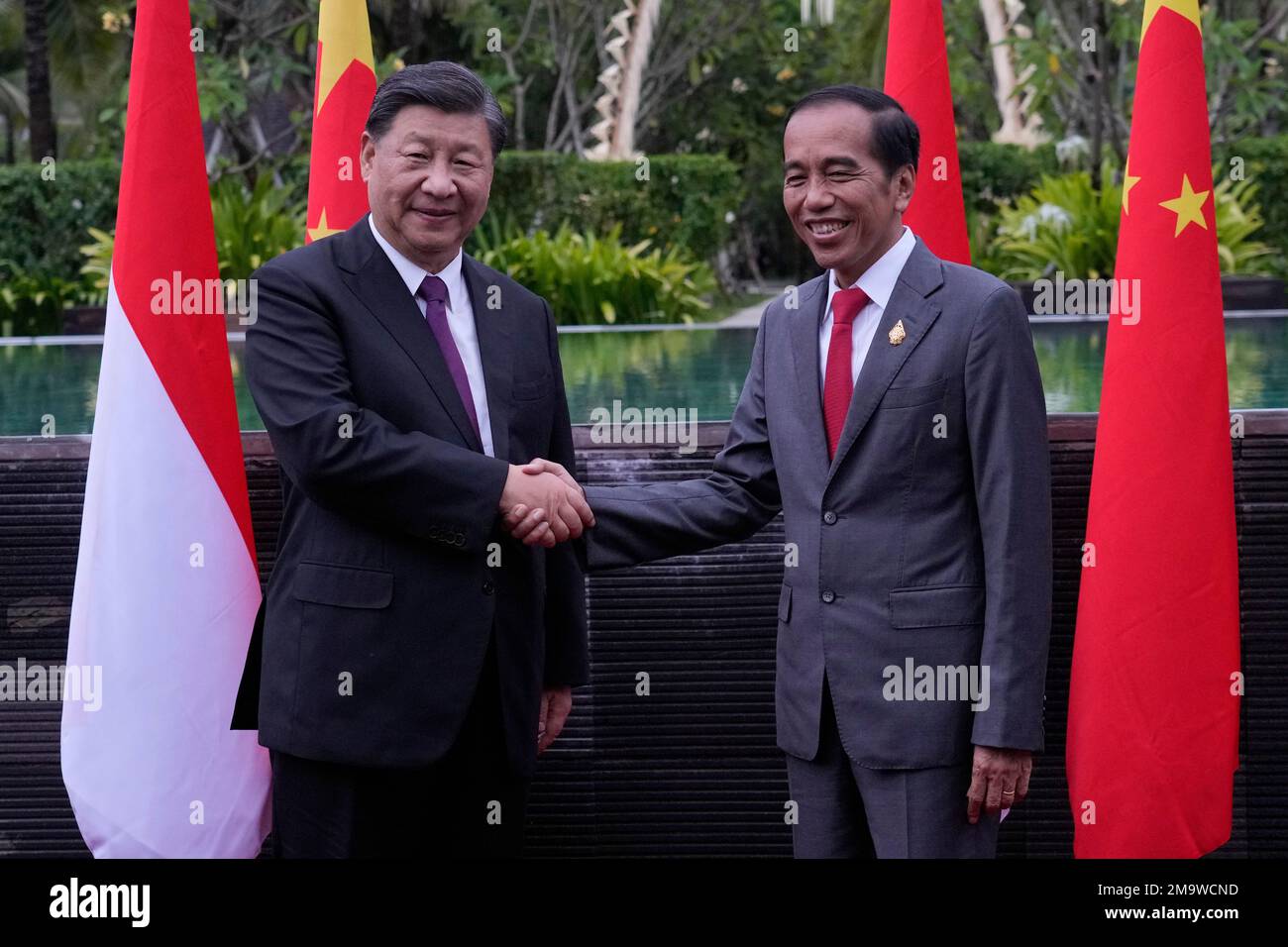 Indonesian President Joko Widodo, right, shakes hands with Chinese ...
