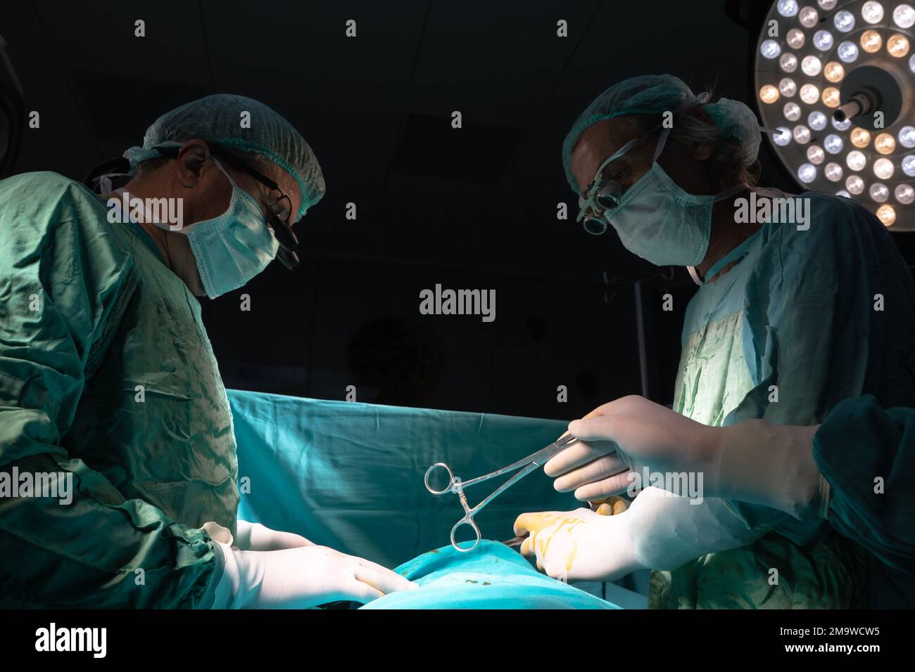 Open heart surgery doctor perform open heart surgery. Doctors in green ...