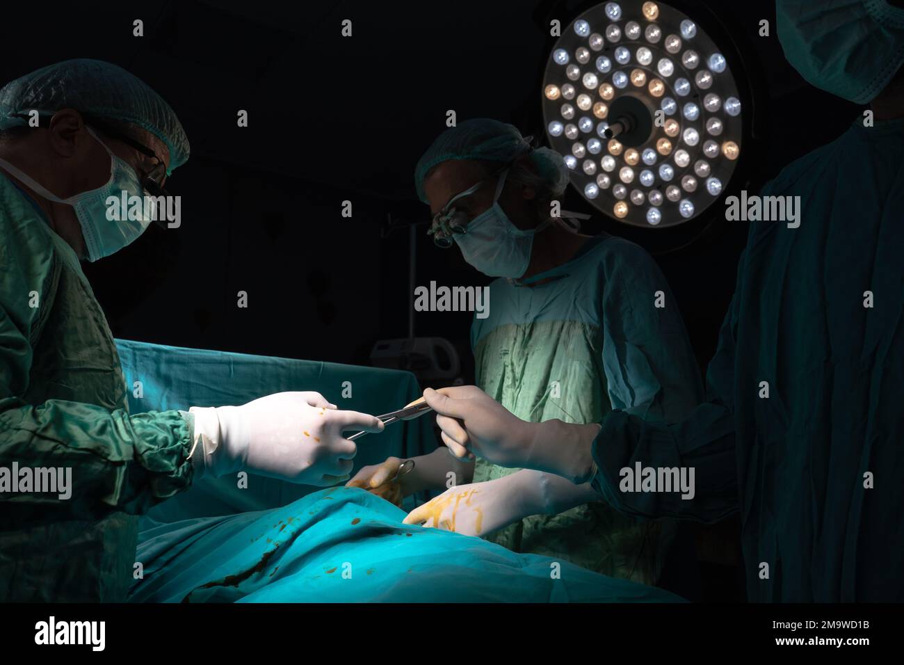 Open heart surgery doctor perform open heart surgery. Doctors in green ...