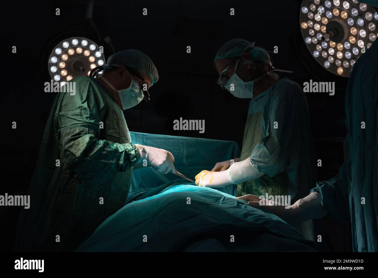 Open heart surgery doctor perform open heart surgery. Doctors in green ...