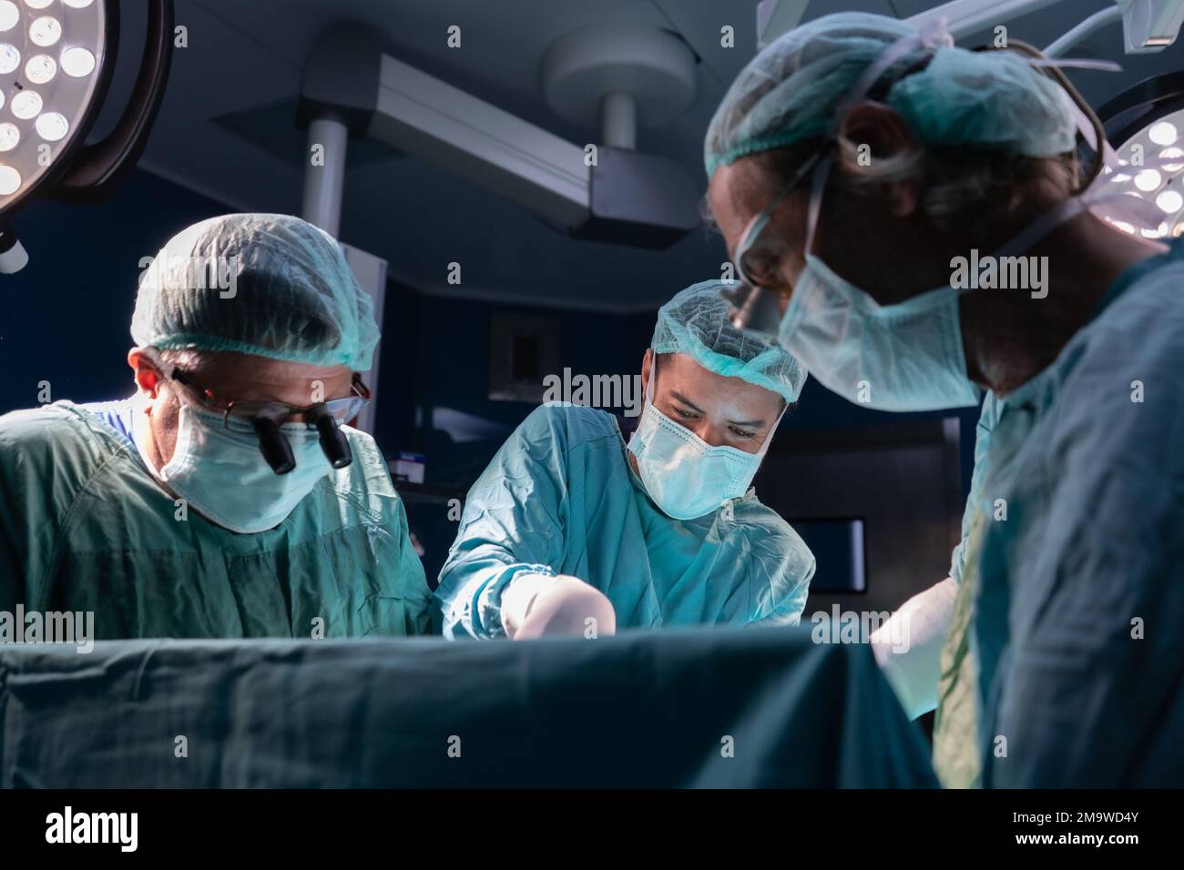 Open heart surgery doctor perform open heart surgery. Doctors in green ...