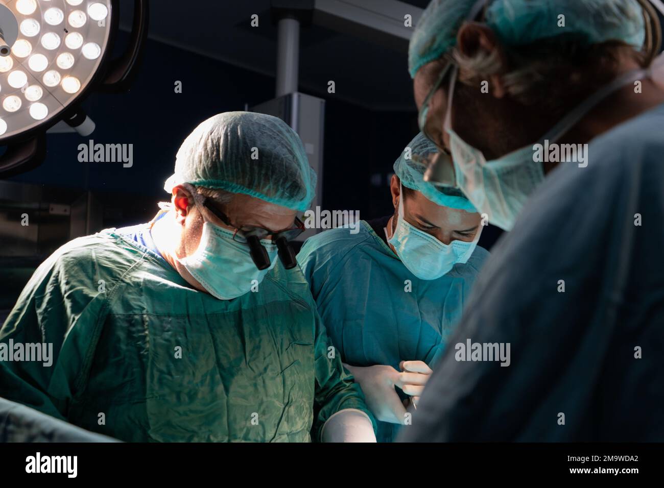 Open heart surgery doctor perform open heart surgery. Doctors in green ...