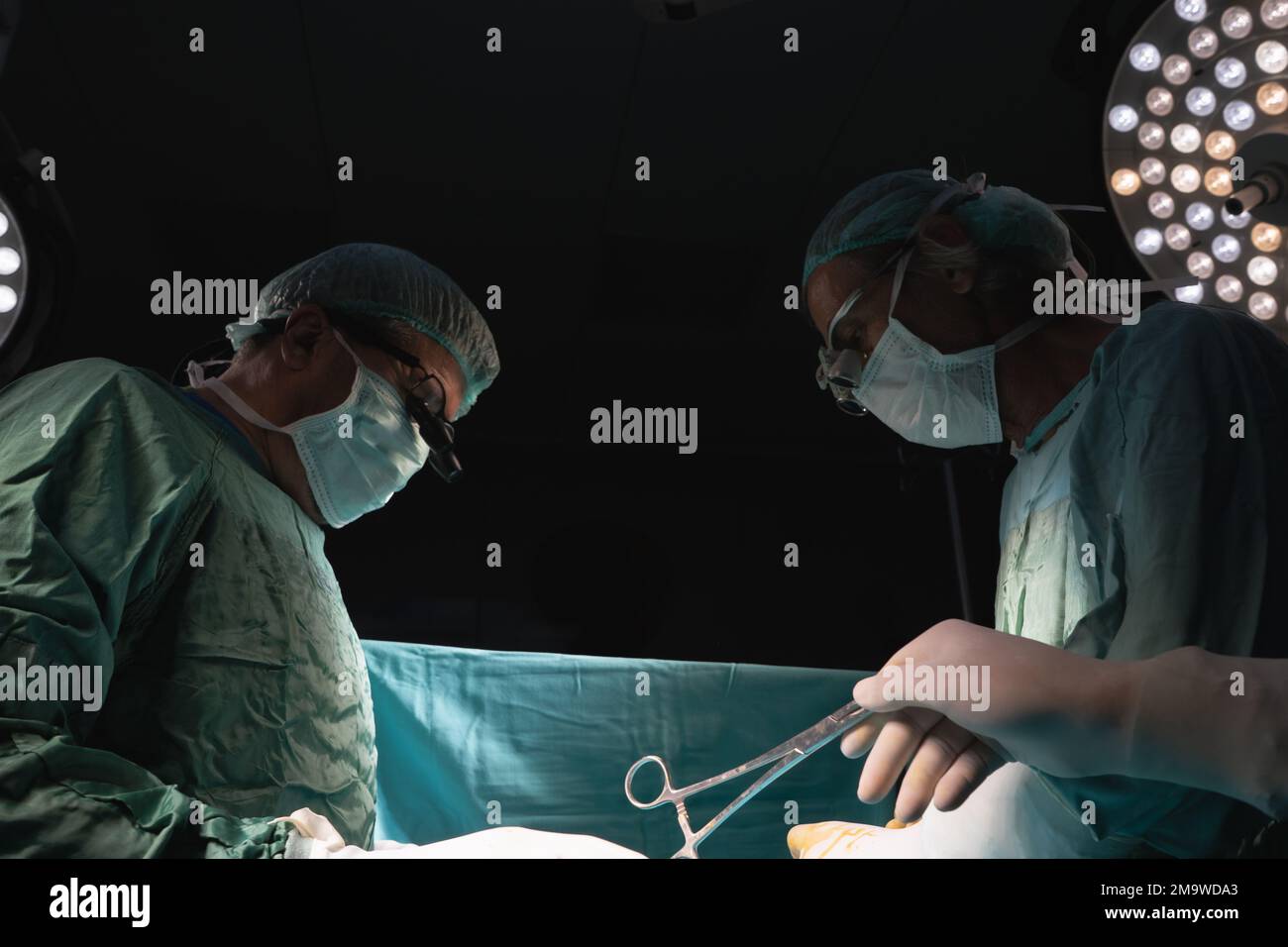 Open heart surgery doctor perform open heart surgery. Doctors in green ...