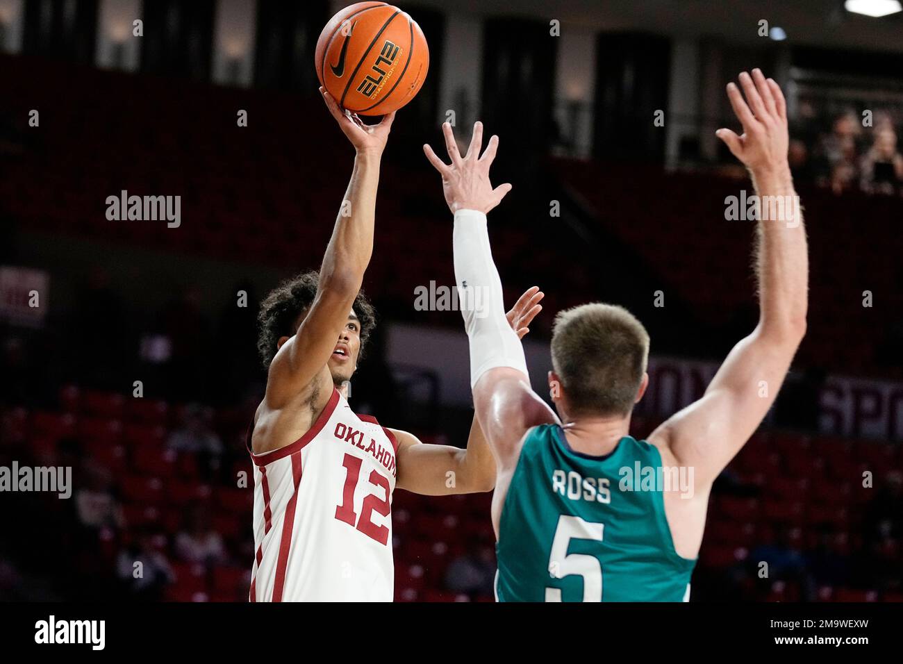 Oklahoma guard Milos Uzan (12) shoots over UNC Wilmington guard Noah ...