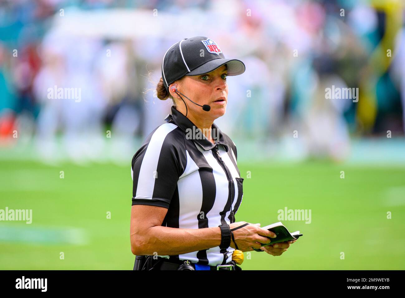 NFL back judge Robin DeLorenzo walks on the field during an NFL ...