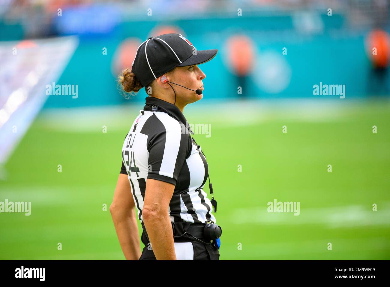 NFL back judge Robin DeLorenzo walks on the field during an NFL ...