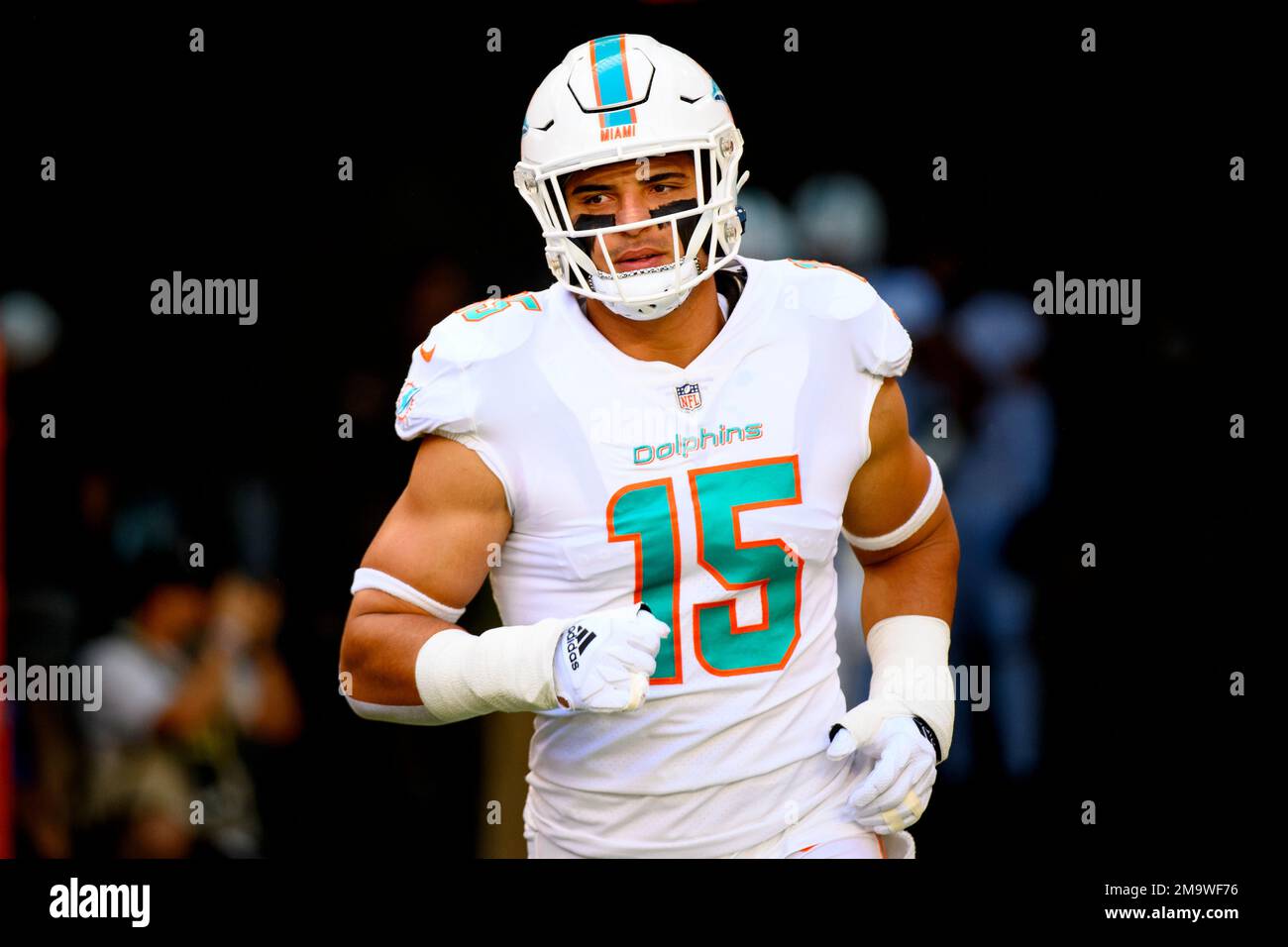Miami Dolphins linebacker Jaelan Phillips (15) runs onto the field ...