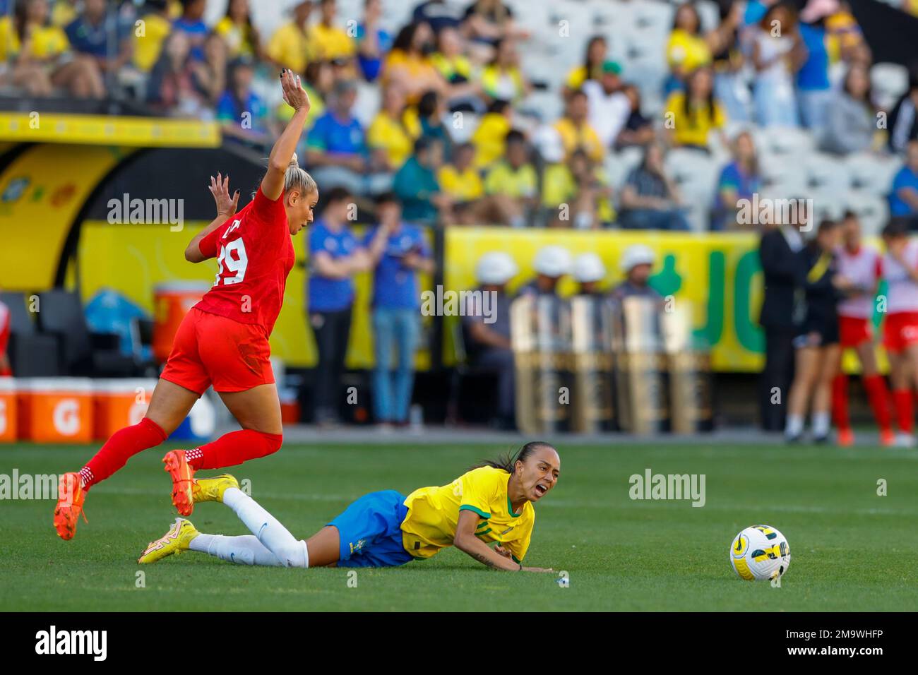 Canada's Adriana Leon, left, trips Brazil's Adriana during a women's ...