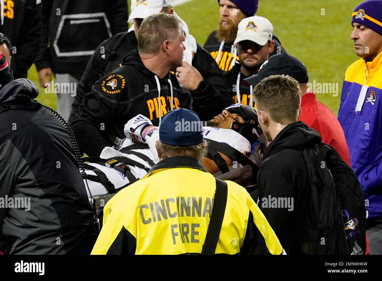 Medical staff attends to East Carolina wide receiver C.J. Johnson ...