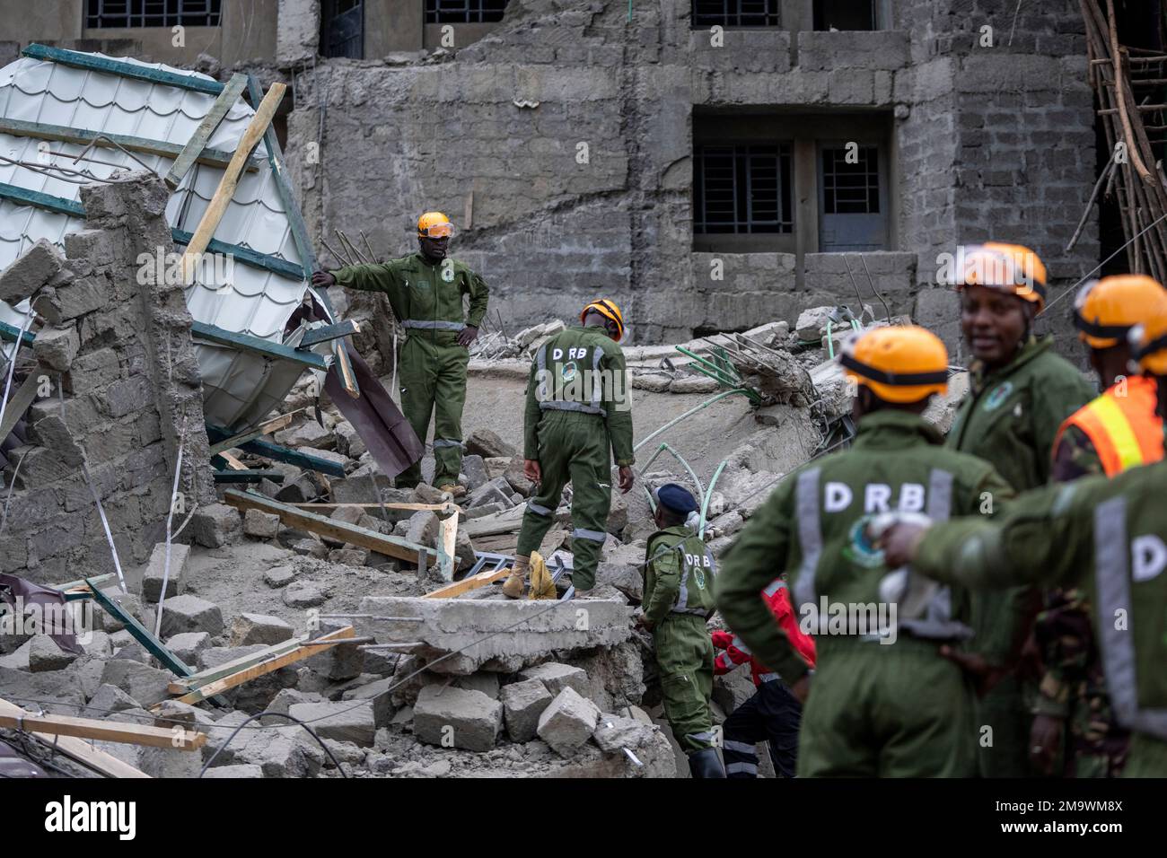 Personnel from the Kenya Defence Forces disaster response unit examine ...