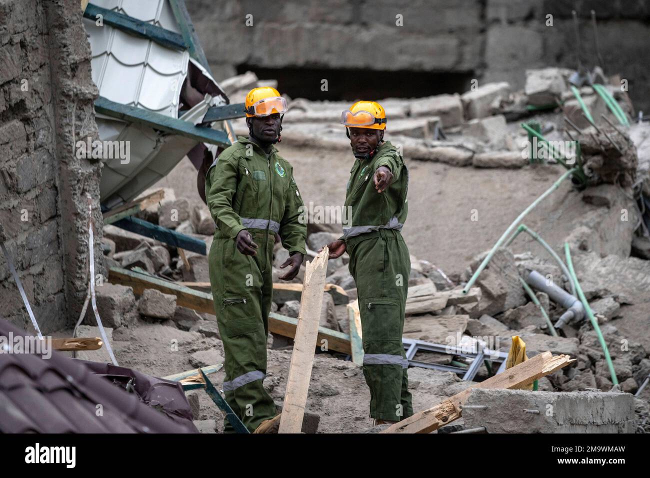 Personnel from the Kenya Defence Forces disaster response unit examine ...