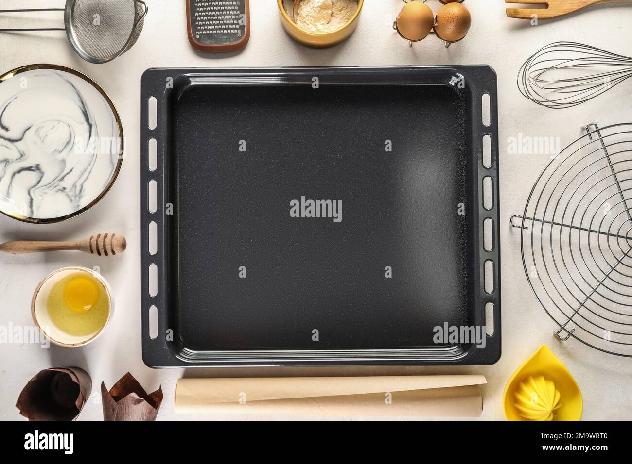 Baking tray with ingredients and utensils on white background Stock ...