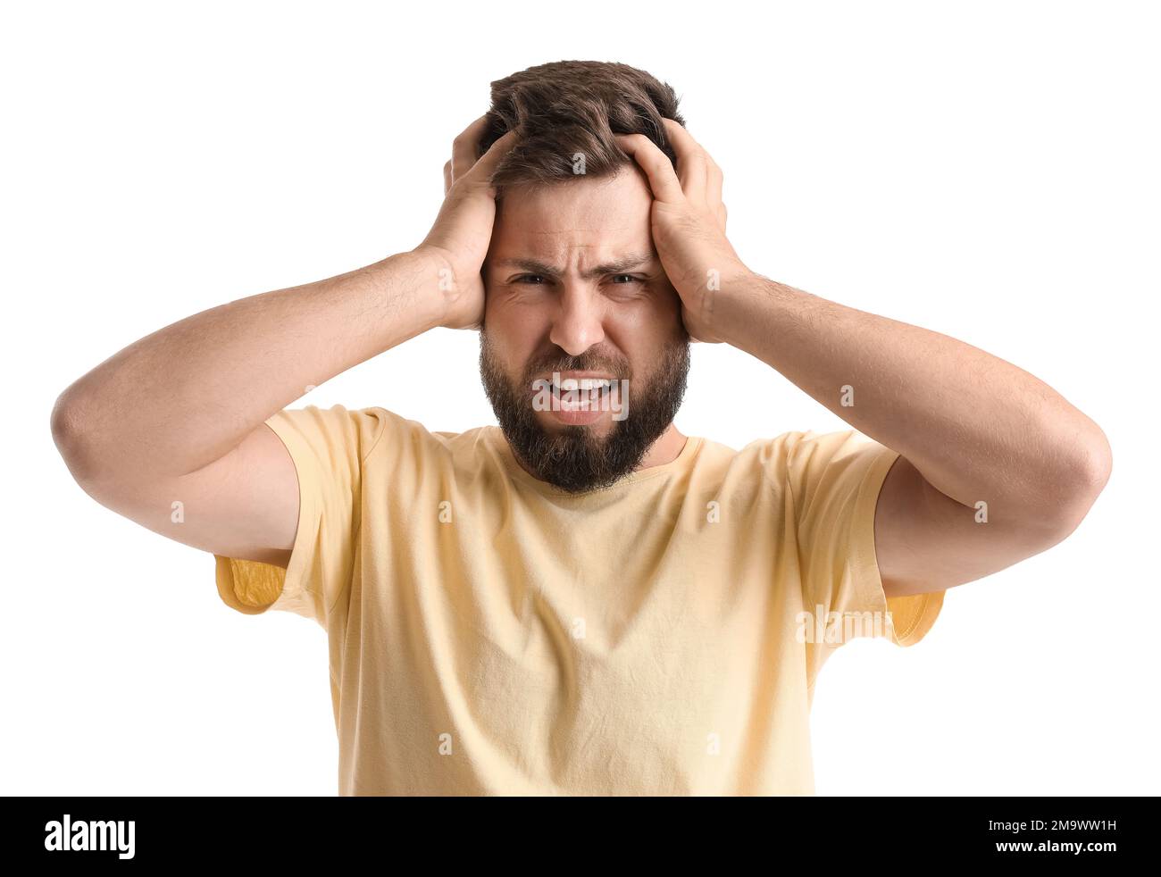 Angry young man on white background Stock Photo - Alamy