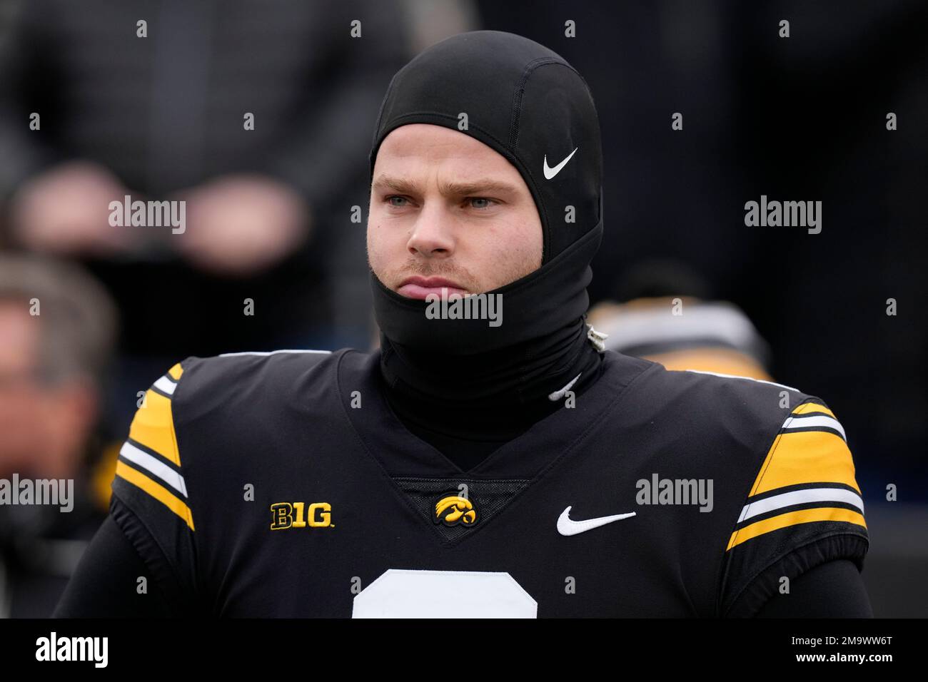 Iowa punter Tory Taylor stands on the field before an NCAA college ...