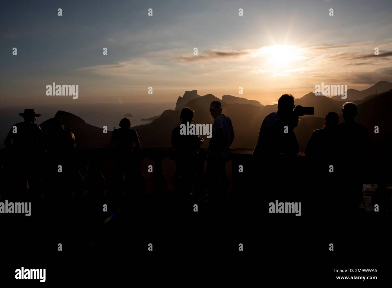 People view the sunset in Rio de Janeiro, Brazil, Wednesday, Jan. 18 ...