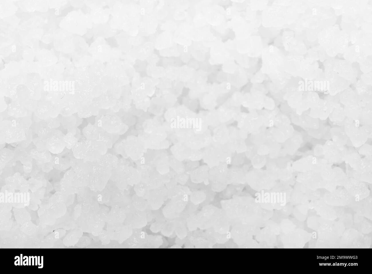 Closeup view of white sea salt as background Stock Photo - Alamy