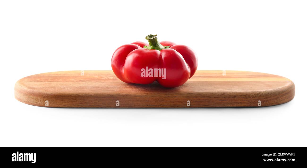 Wooden board with red bell pepper on white background Stock Photo - Alamy