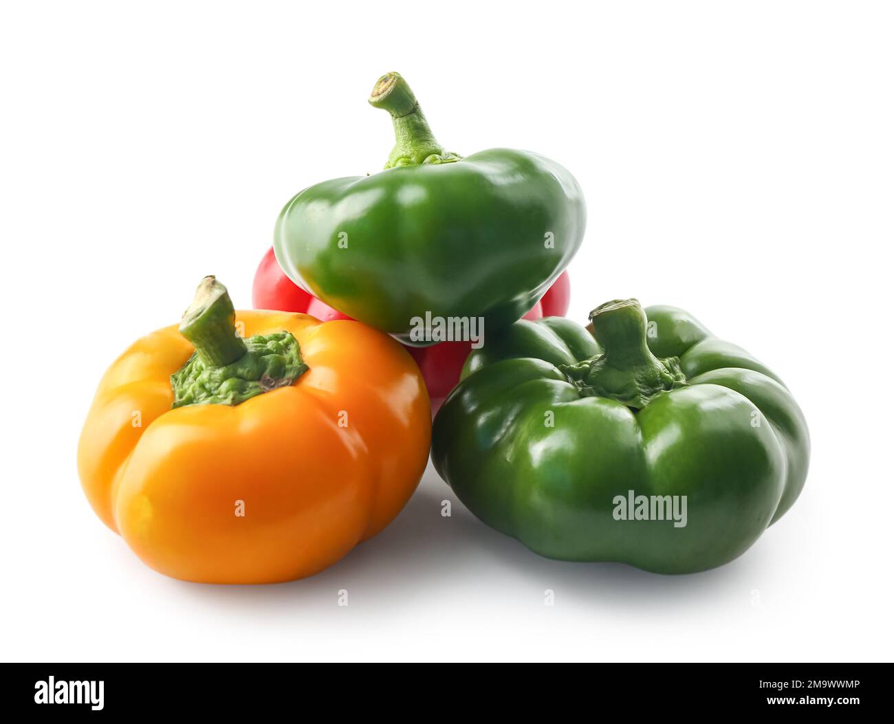 Heap of fresh bell peppers isolated on white background Stock Photo - Alamy