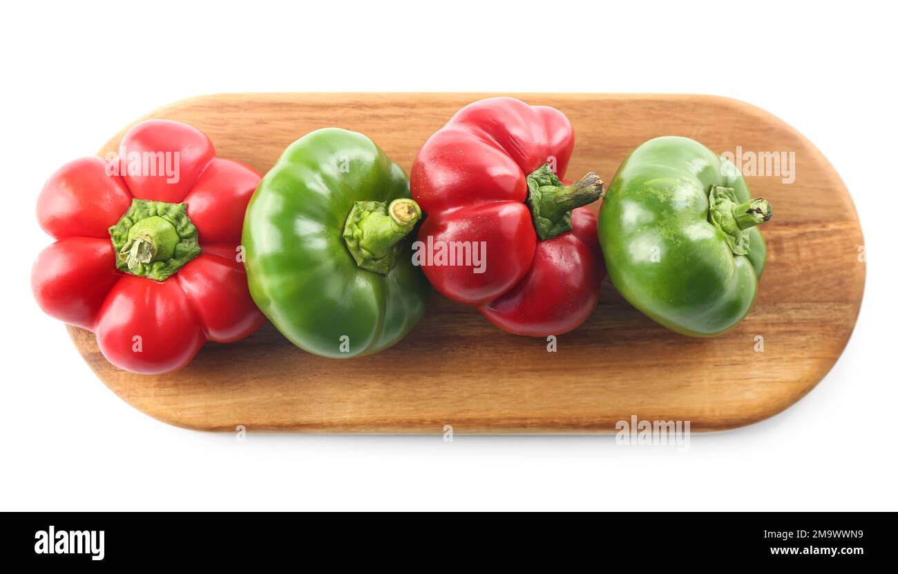 Wooden board with fresh bell peppers on white background Stock Photo ...