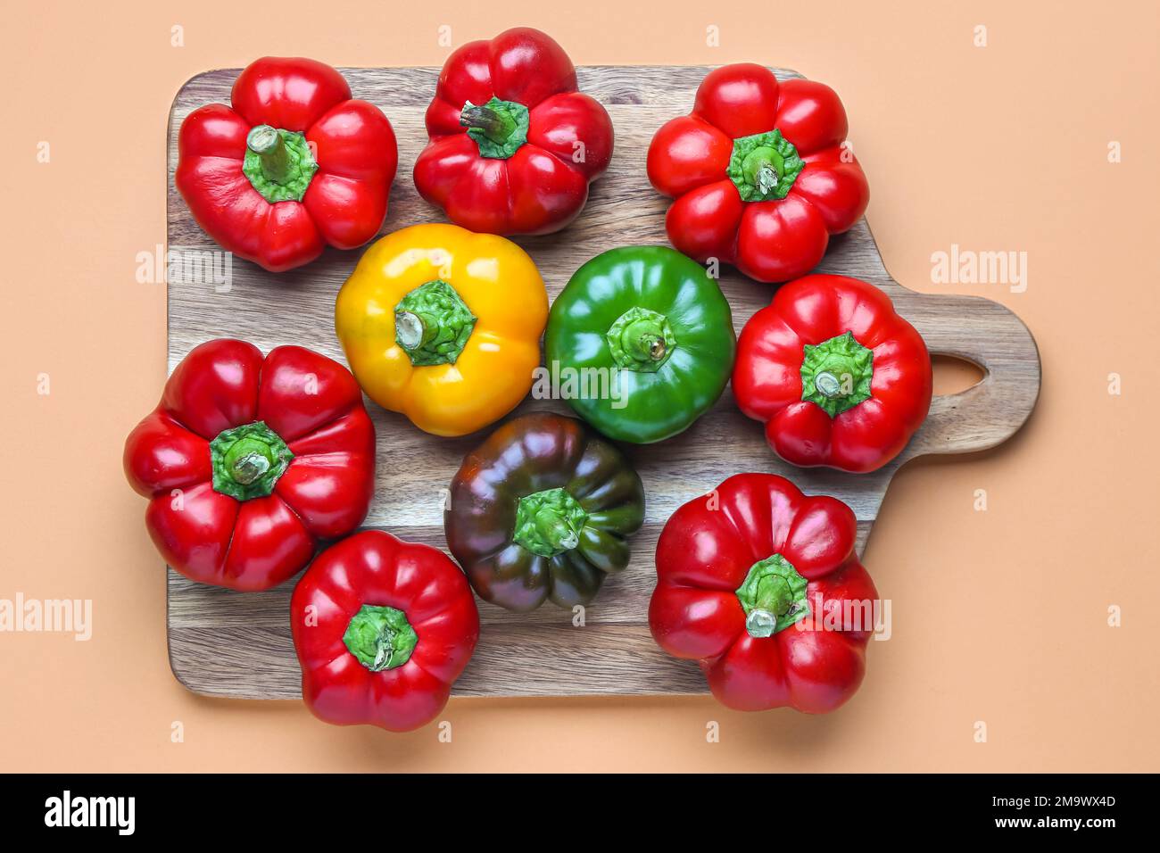 Bell peppers on wooden background Stock Photo - Alamy