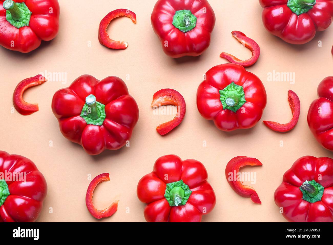 Composition with red bell peppers on color background Stock Photo - Alamy