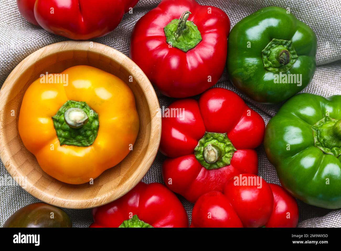 Fresh bell peppers on fabric background, closeup Stock Photo - Alamy