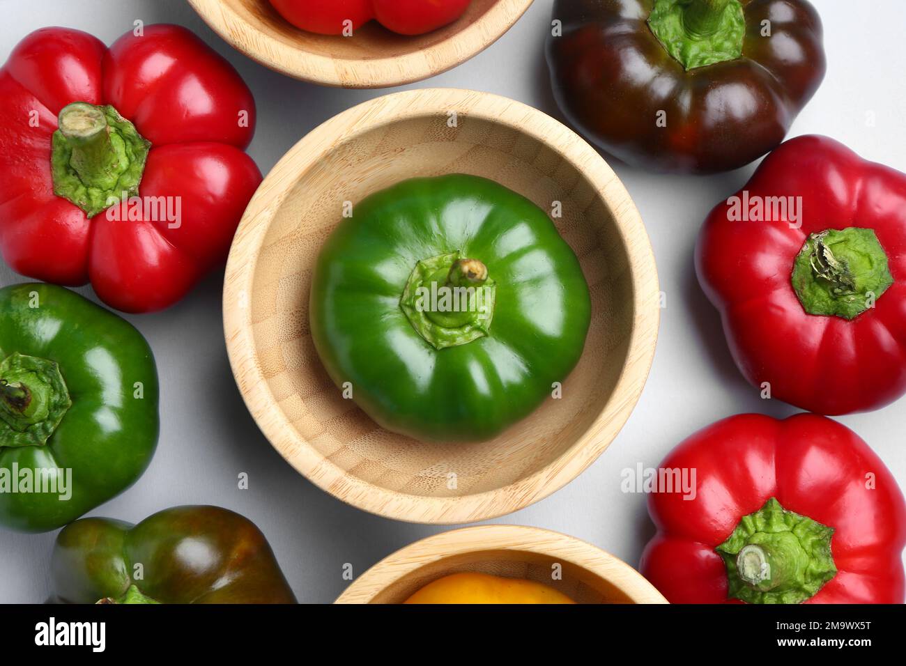 Composition with fresh bell peppers on white background, closeup Stock ...