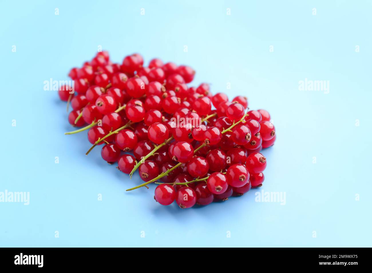 Heap of ripe red currant on color background Stock Photo - Alamy