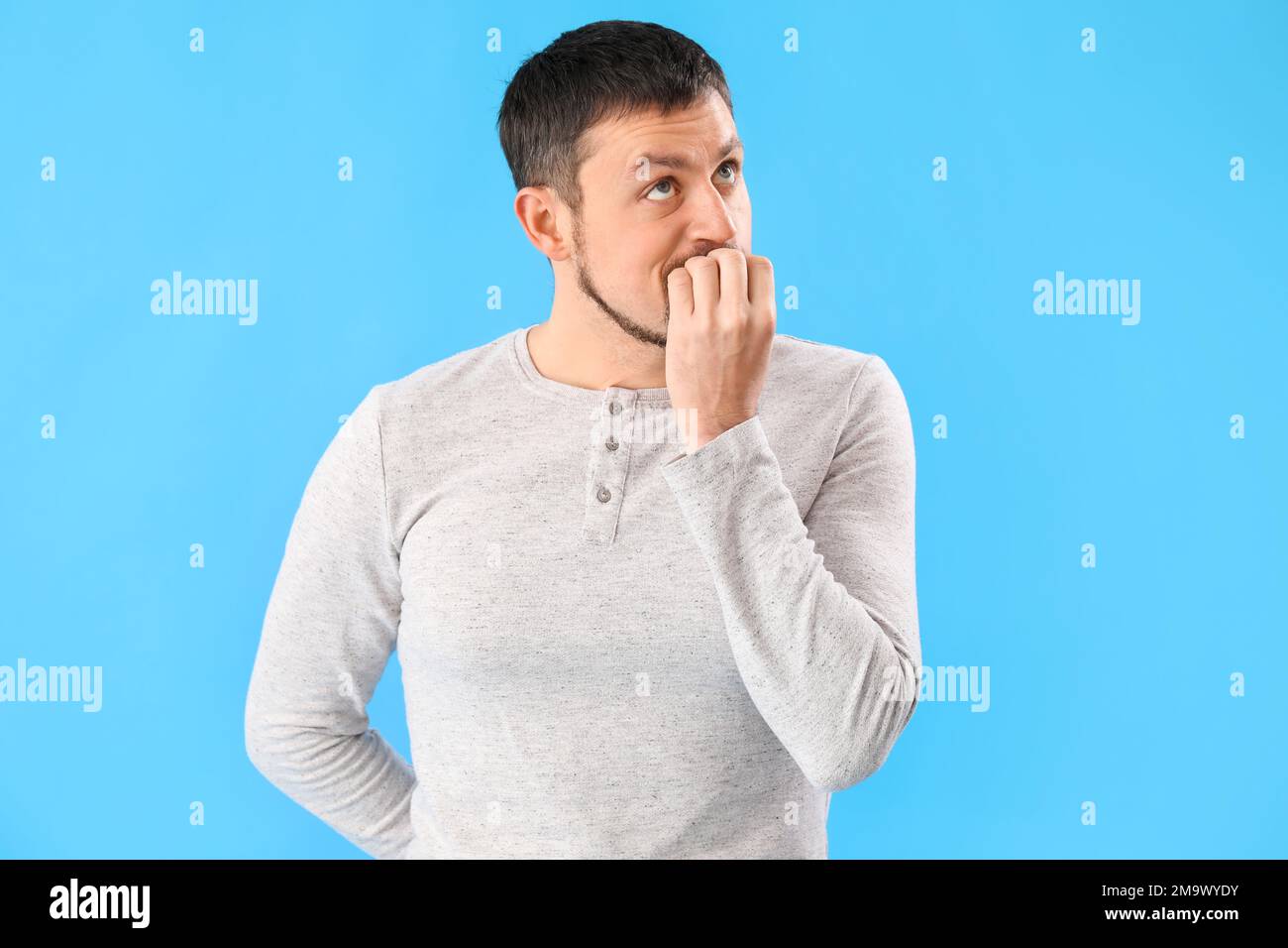 Man biting nails hi-res stock photography and images - Alamy