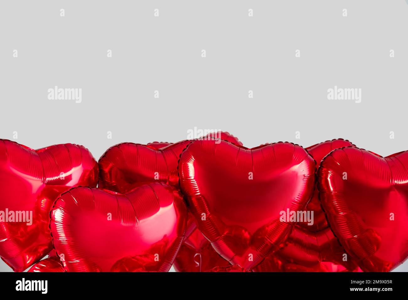 Heart shaped balloons for Valentine's Day on light background Stock ...