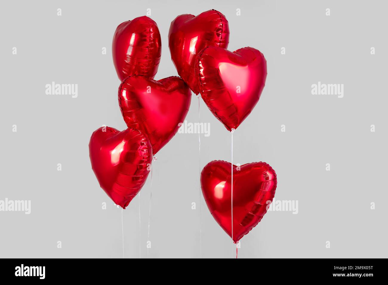 Heart shaped balloons for Valentine's Day on light background Stock ...