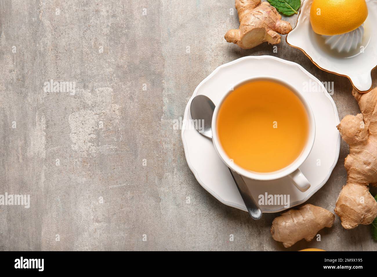 Cup of tea, lemon, spoon and ginger on grunge background Stock Photo ...