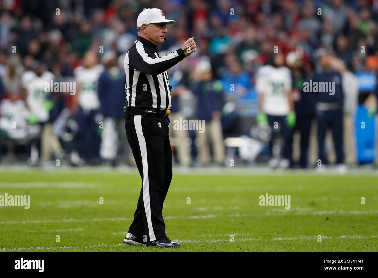Referee John Hussey (35) works during an NFL football game between the ...