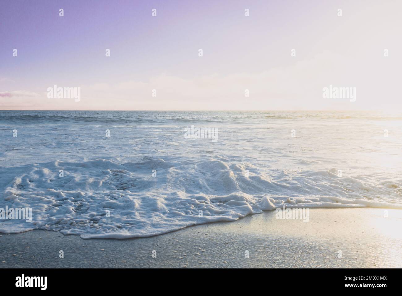 Waves washing up beach over hi-res stock photography and images - Alamy