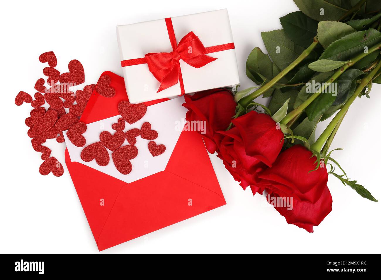 Gift boxes, rose flowers, envelope and hearts isolated on white ...