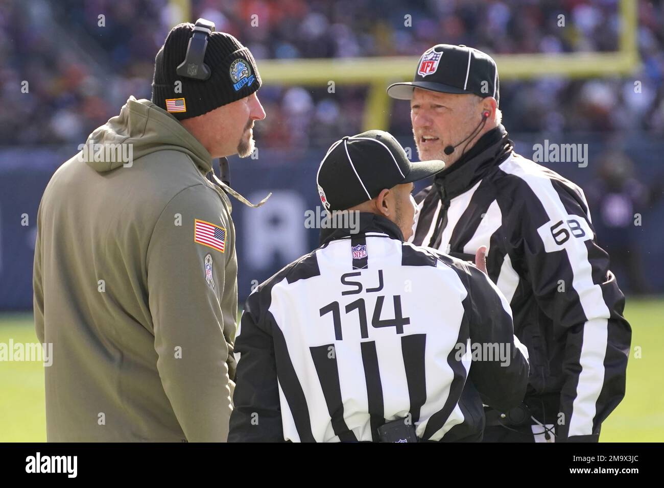 Detroit Lions head coach Dan Campbell listens to side judge Dominique ...