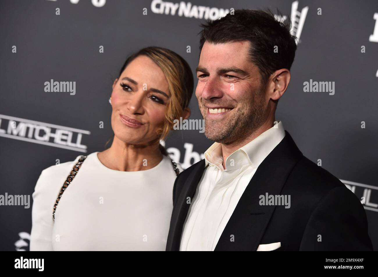 Tess Sanchez, left, and Max Greenfield arrive at the 2022 Baby2Baby ...