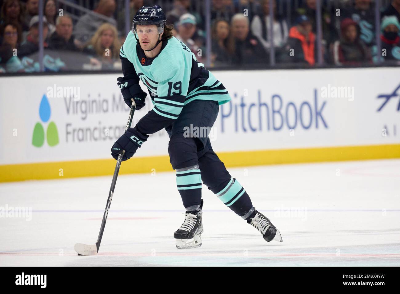 Seattle Kraken left wing Jared McCann (19) skates with the puck against ...