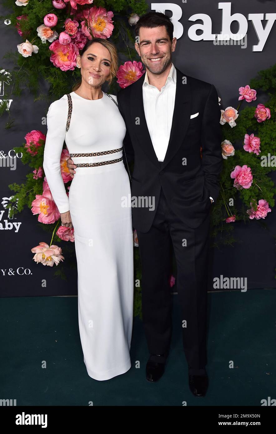 Tess Sanchez, left, and Max Greenfield arrive at the 2022 Baby2Baby ...